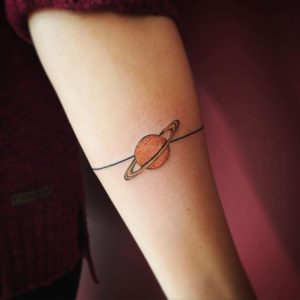 35 Amazing Saturn Tattoos With Meanings, Ideas - Body Art Guru