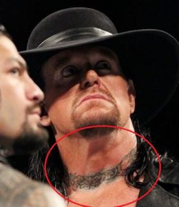 Undertaker's 4 Tattoos & Their Meanings - Body Art Guru