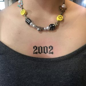 10 Amazing "2002" Tattoo Designs - Body Art Guru