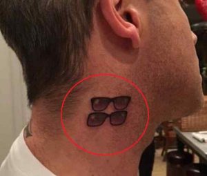 Robbie Williams' 22 Tattoos & Their Meanings - Body Art Guru