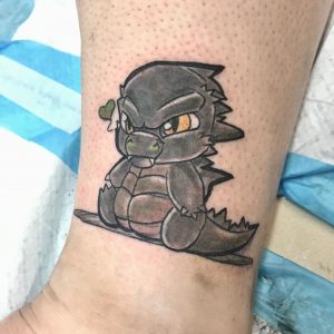 86 Ferocious Godzilla Tattoo Ideas with Meanings - Body Art Guru