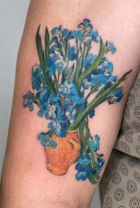 30 Mesmerizing Iris Tattoo with Meaning and Ideas - Body Art Guru