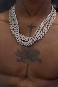 Rema's (Singer) 13 Tattoos and their Meanings - Body Art Guru